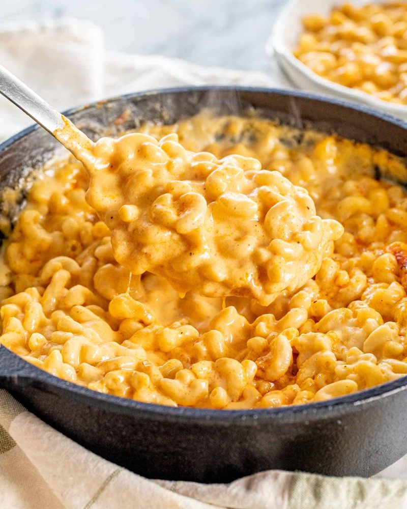 Why You Should Start Layering Your Baked Mac & Cheese Like A Lasagna